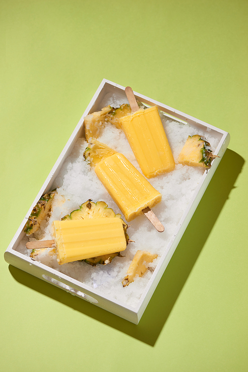 Yellow fruit popsicles on a tray top view, summer mood | 유토이미지 | 상세페이지 ...